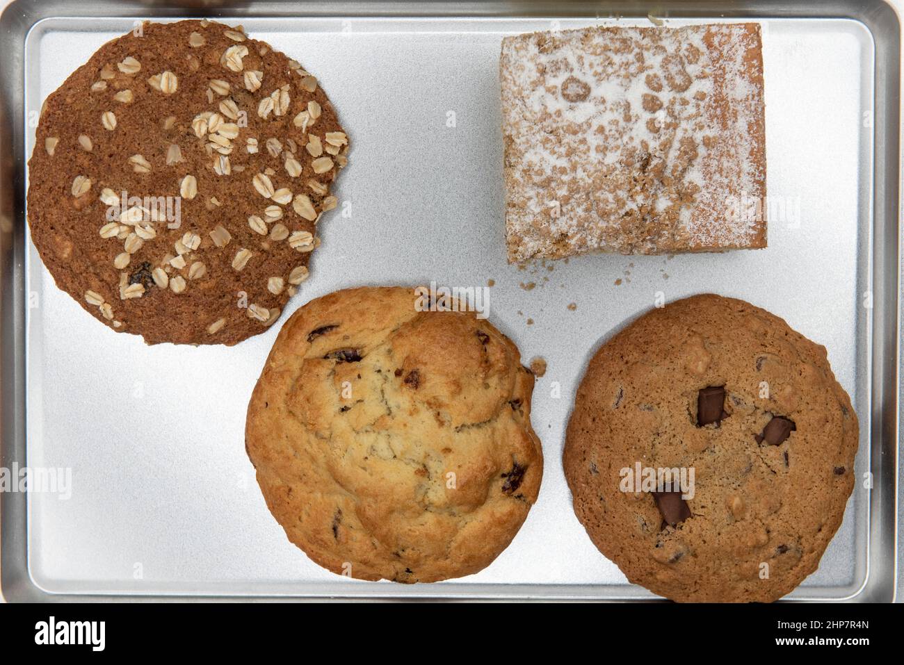 Variety of baked items on a cookie tray and fresh from the warm oven ...