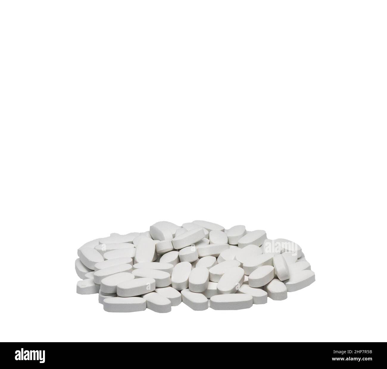 Loose white oval powders. Pills are isolated on a white background ...