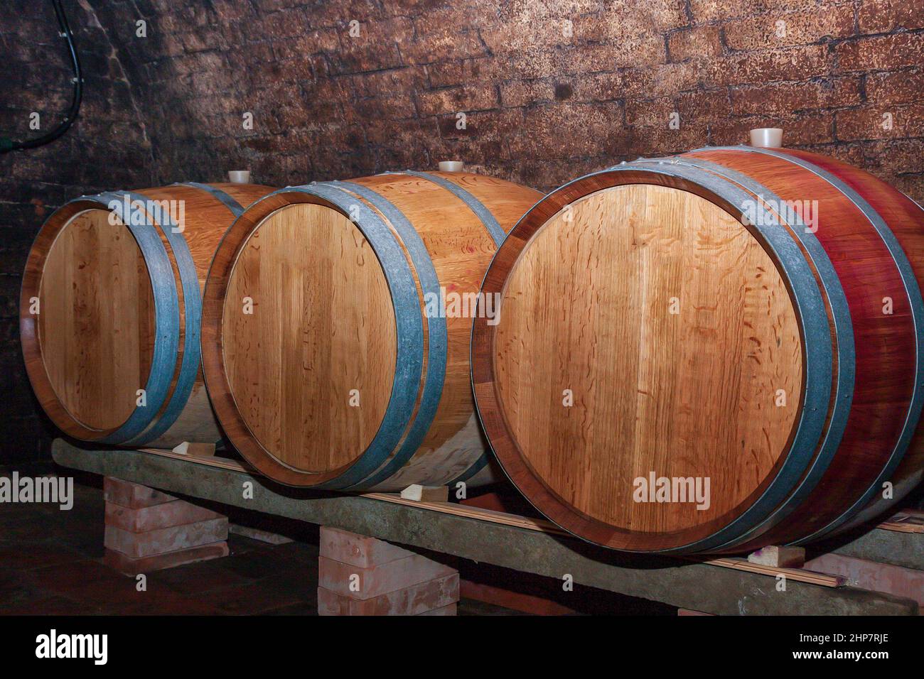 Wooden wine barrels in a wine cellar Stock Photo - Alamy