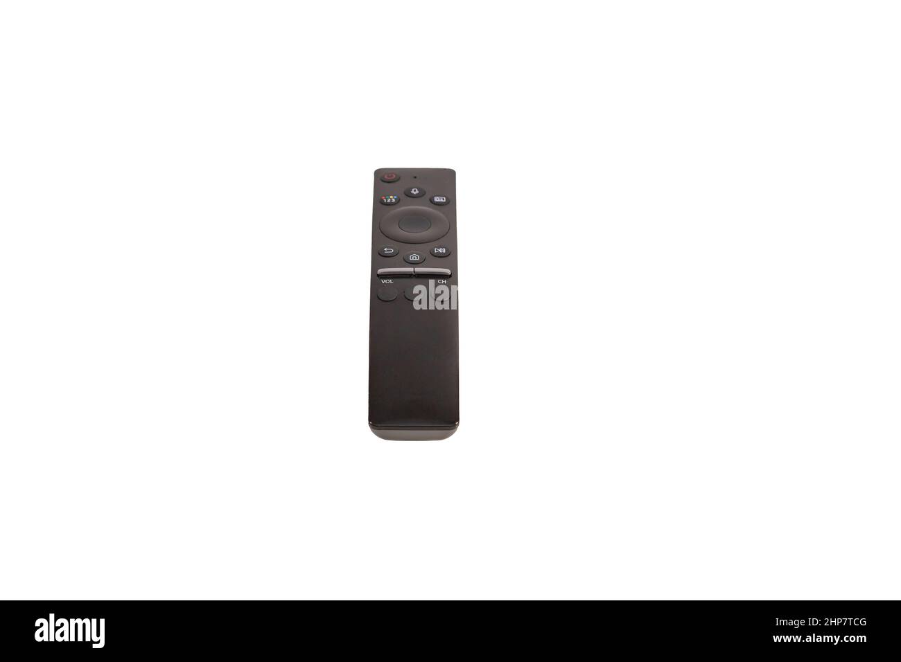 The small narrow black remote control on the TV lies on a white ...