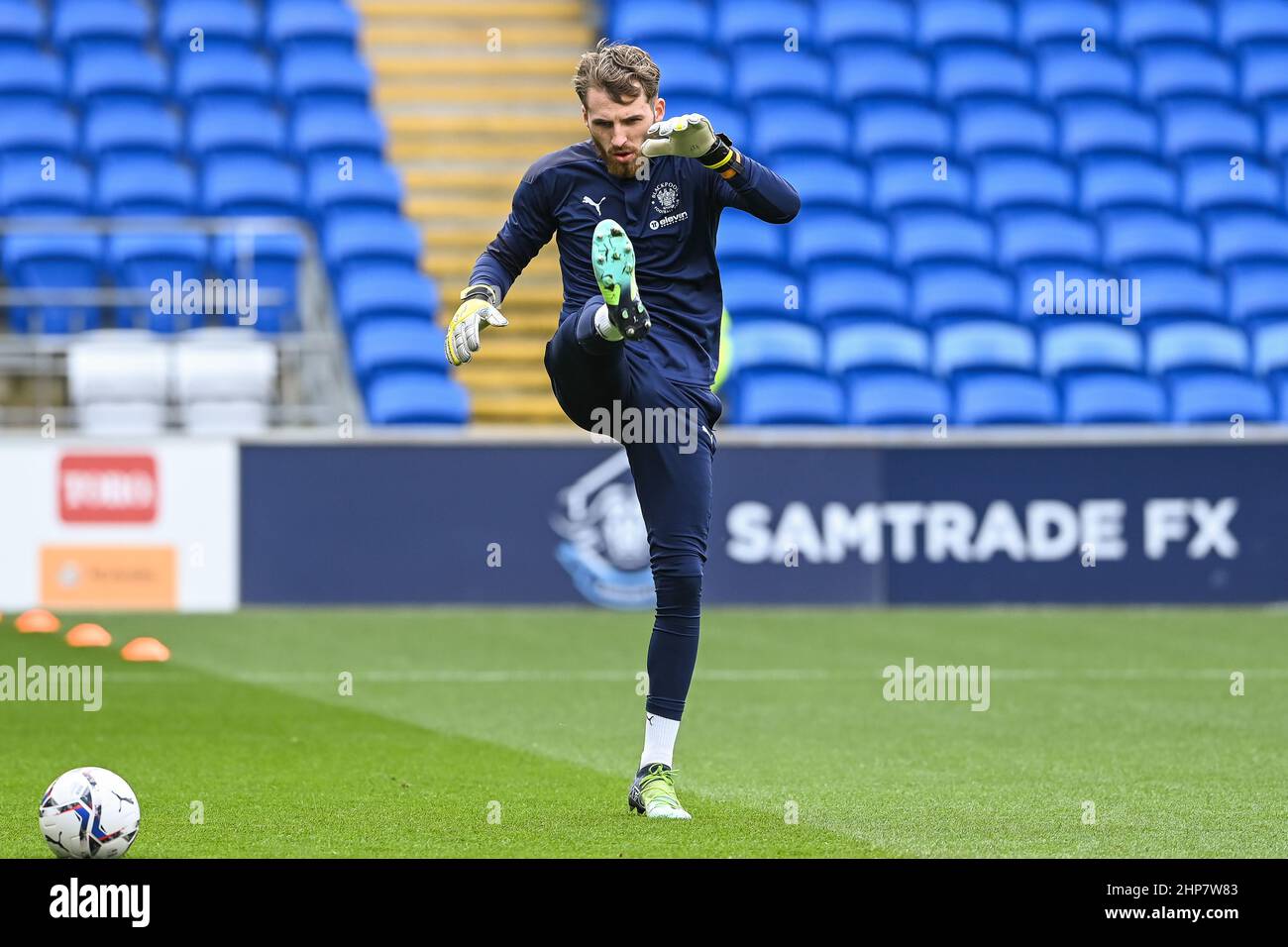 Daniel Grimshaw #32 of Blackpool stretches during the pre-game warmup ...