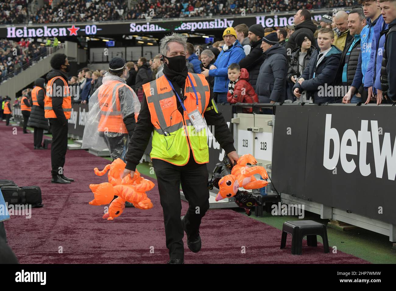 London, UK. 19th Feb, 2022. A match day steward removes inflatable cats ...