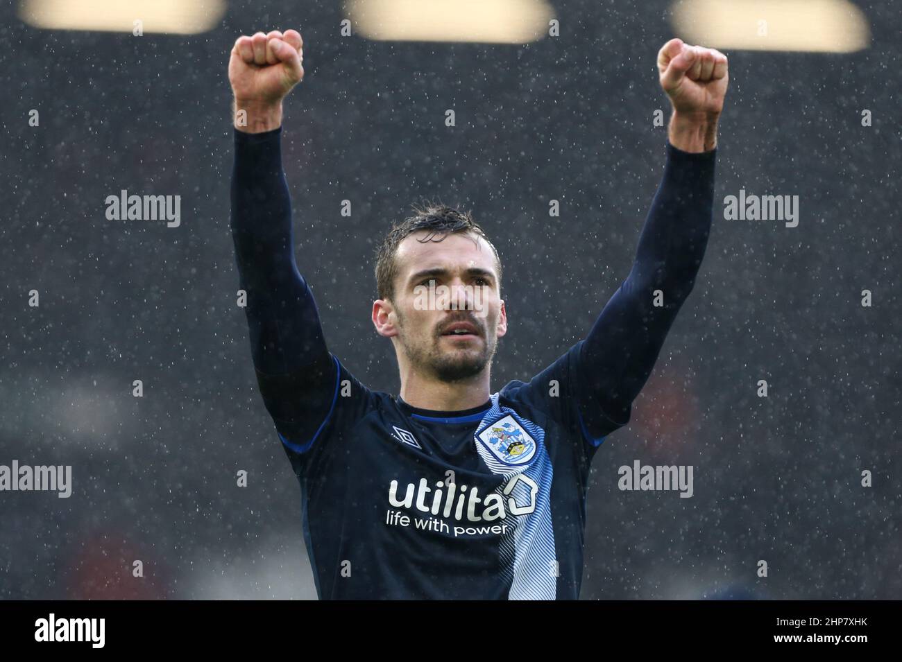 Harry Toffolo #3 of Huddersfield Town celebrates in front of the fans ...