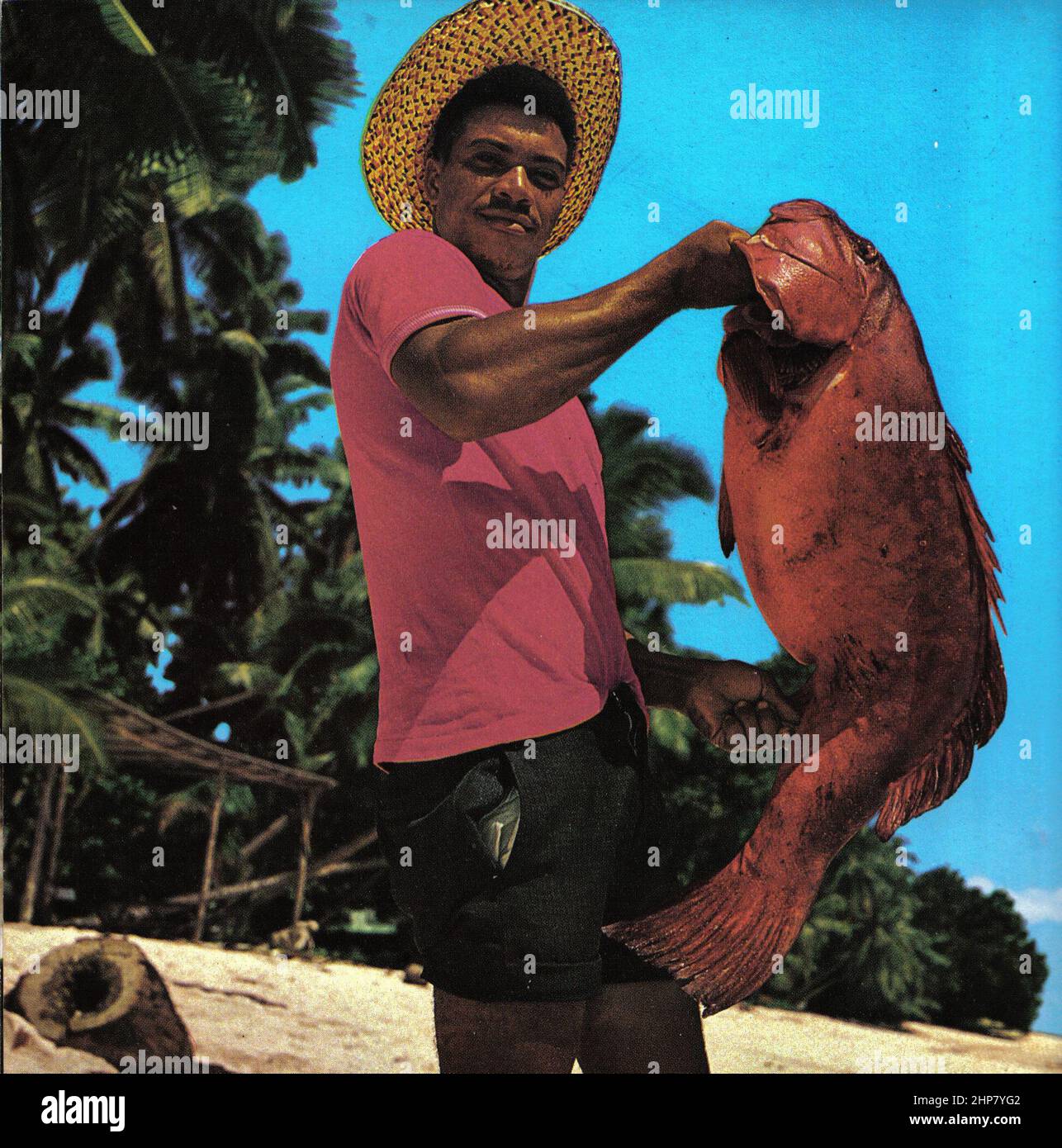 1970s fisherman holding fish hi-res stock photography and images - Alamy