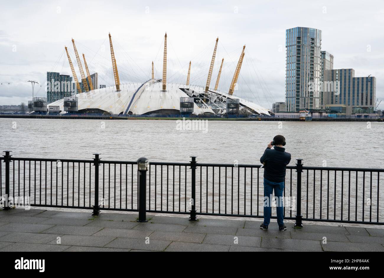 A man takes a photo of the O2 Arena in London, after parts of its roof ...