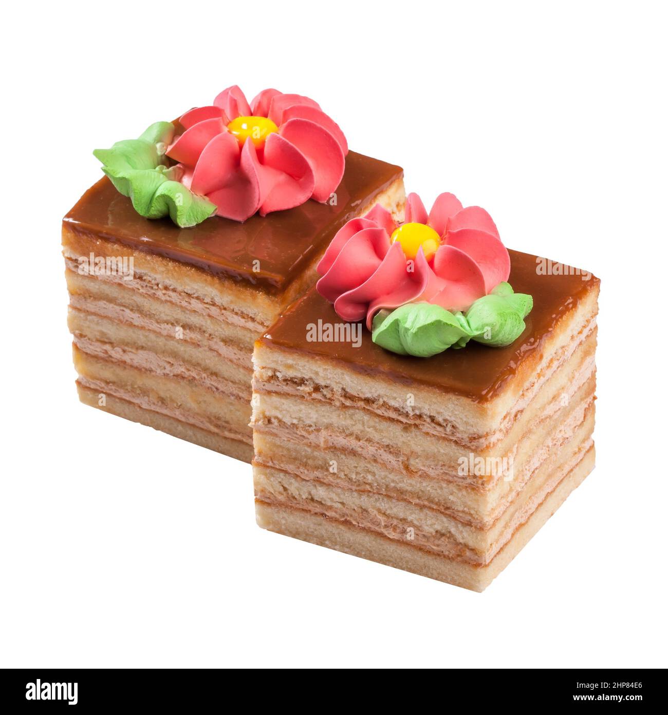 Layered sponge cake topped with caramel and decorated with buttercream ...