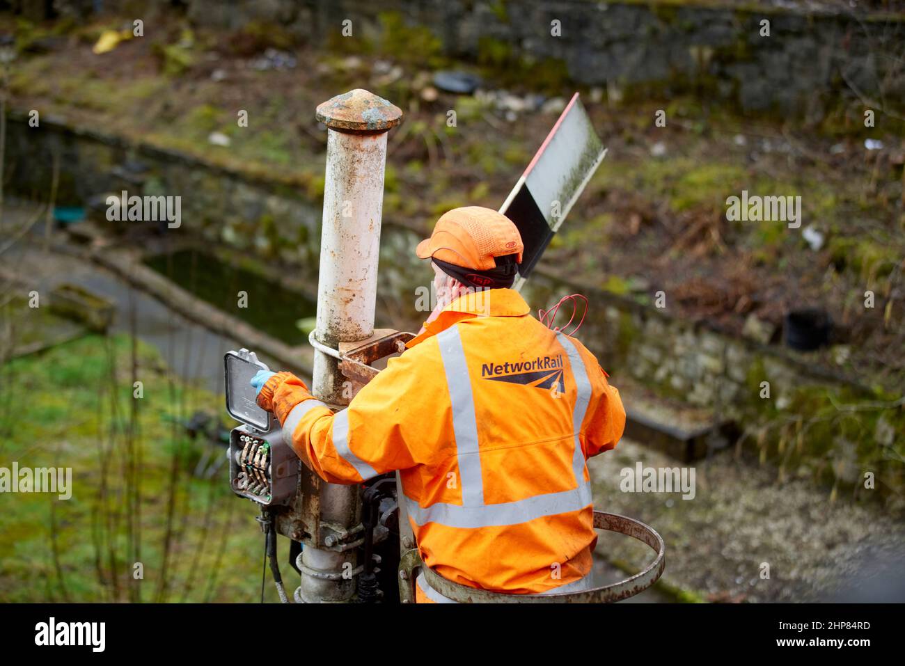 Network Rail engineer fixing an old semaphore signal in Buxton Stock ...