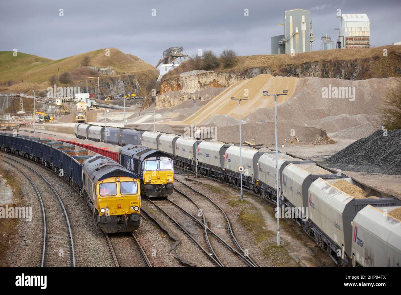 British Rail Class 66 66422 leaving CEMEX Dove Holes Quarry into the ...