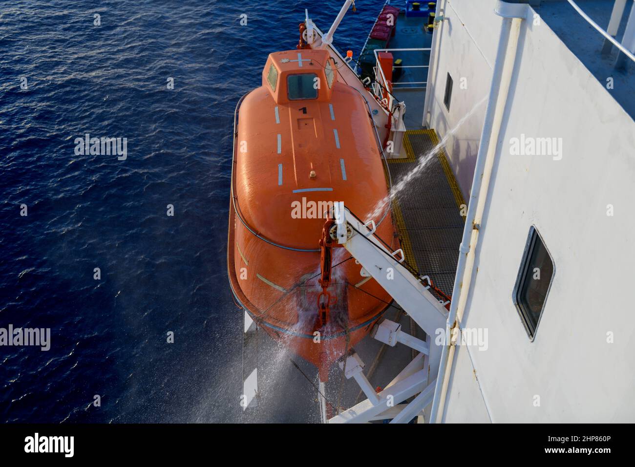 Hose pressure water test of totally enclosed lifeboat. Watertight test ...