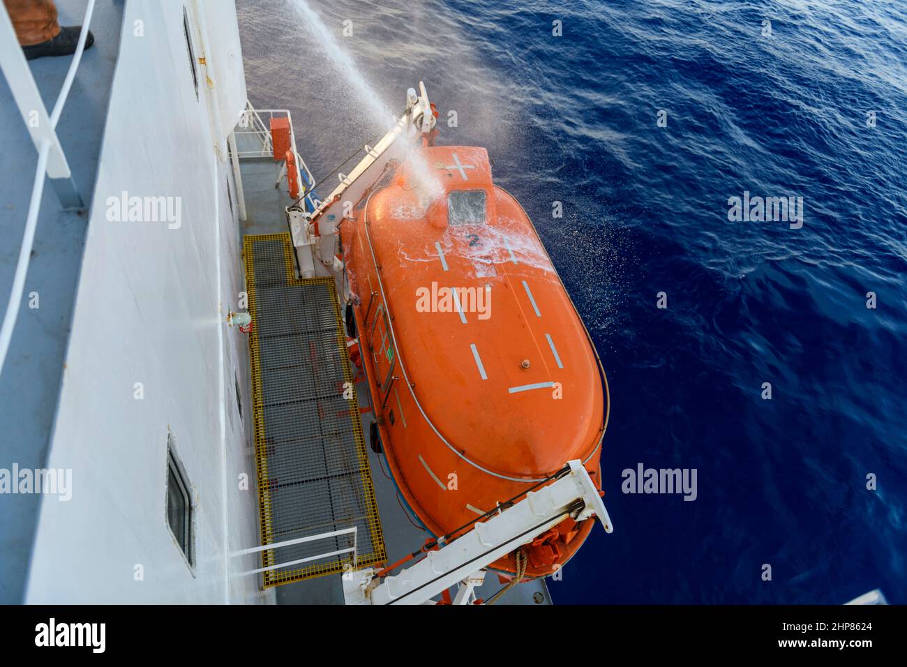 Hose pressure water test of totally enclosed lifeboat. Watertight test ...