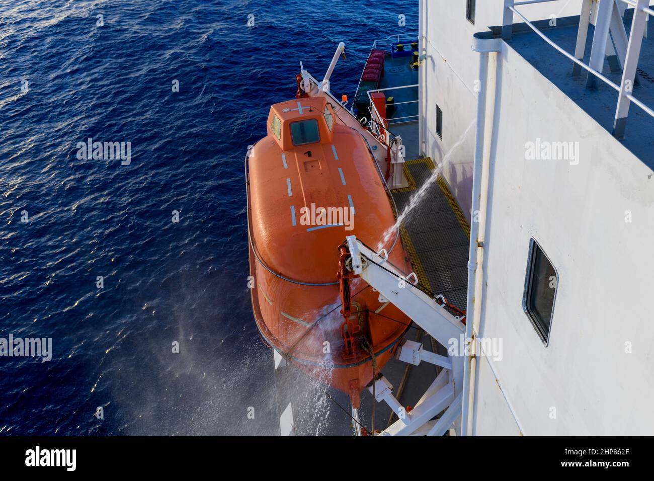 Hose pressure water test of totally enclosed lifeboat. Watertight test ...