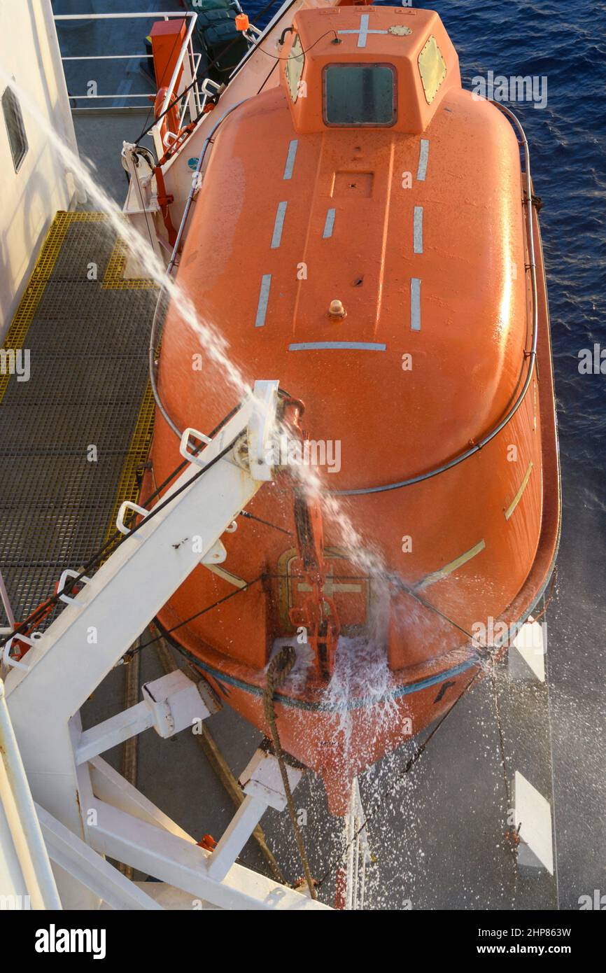 Hose pressure water test of totally enclosed lifeboat. Watertight test ...
