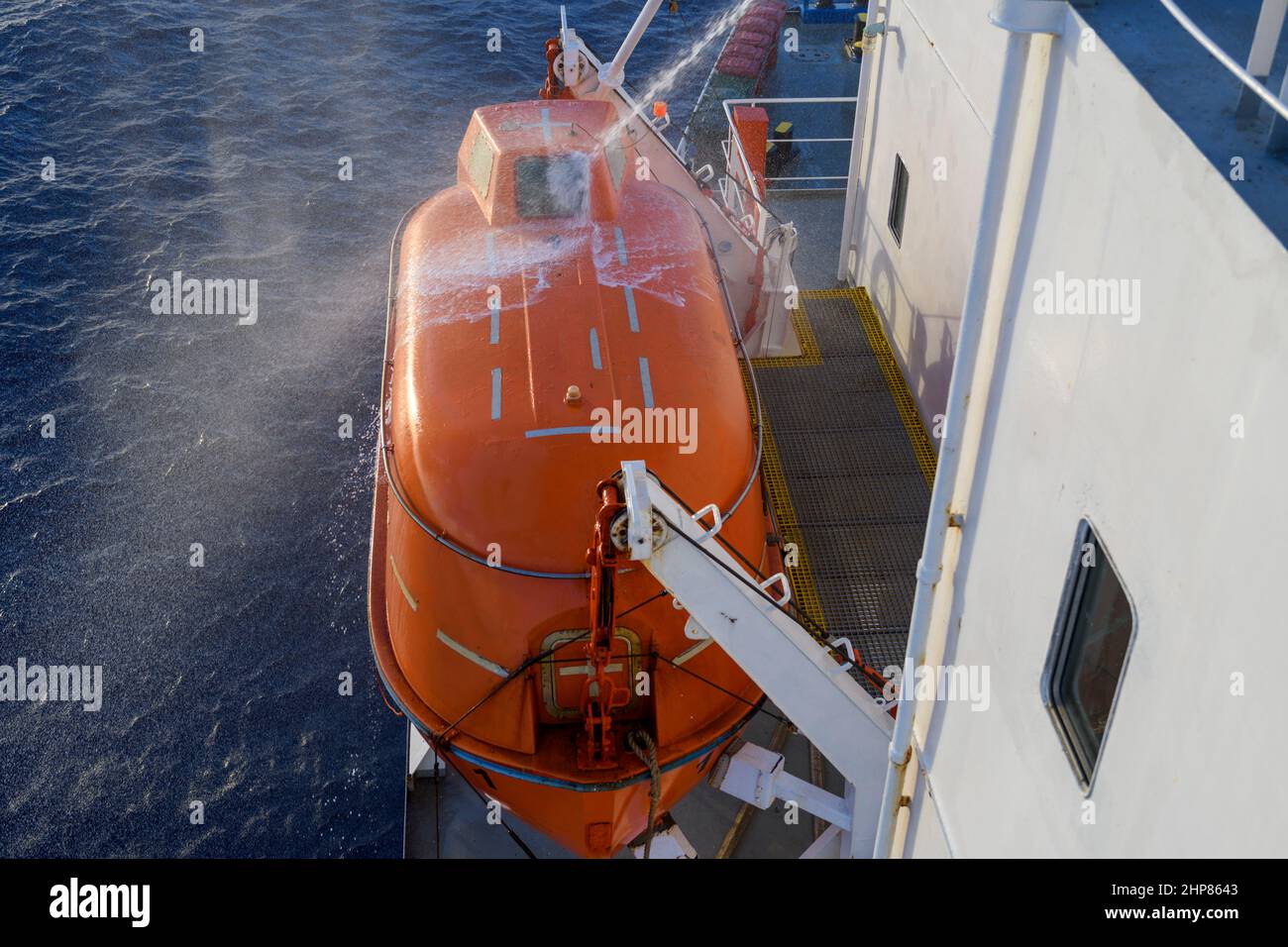 Hose pressure water test of totally enclosed lifeboat. Watertight test ...