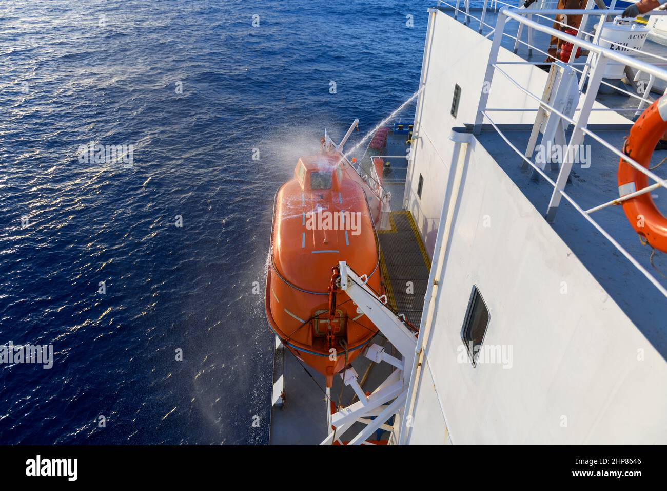 Hose pressure water test of totally enclosed lifeboat. Watertight test ...