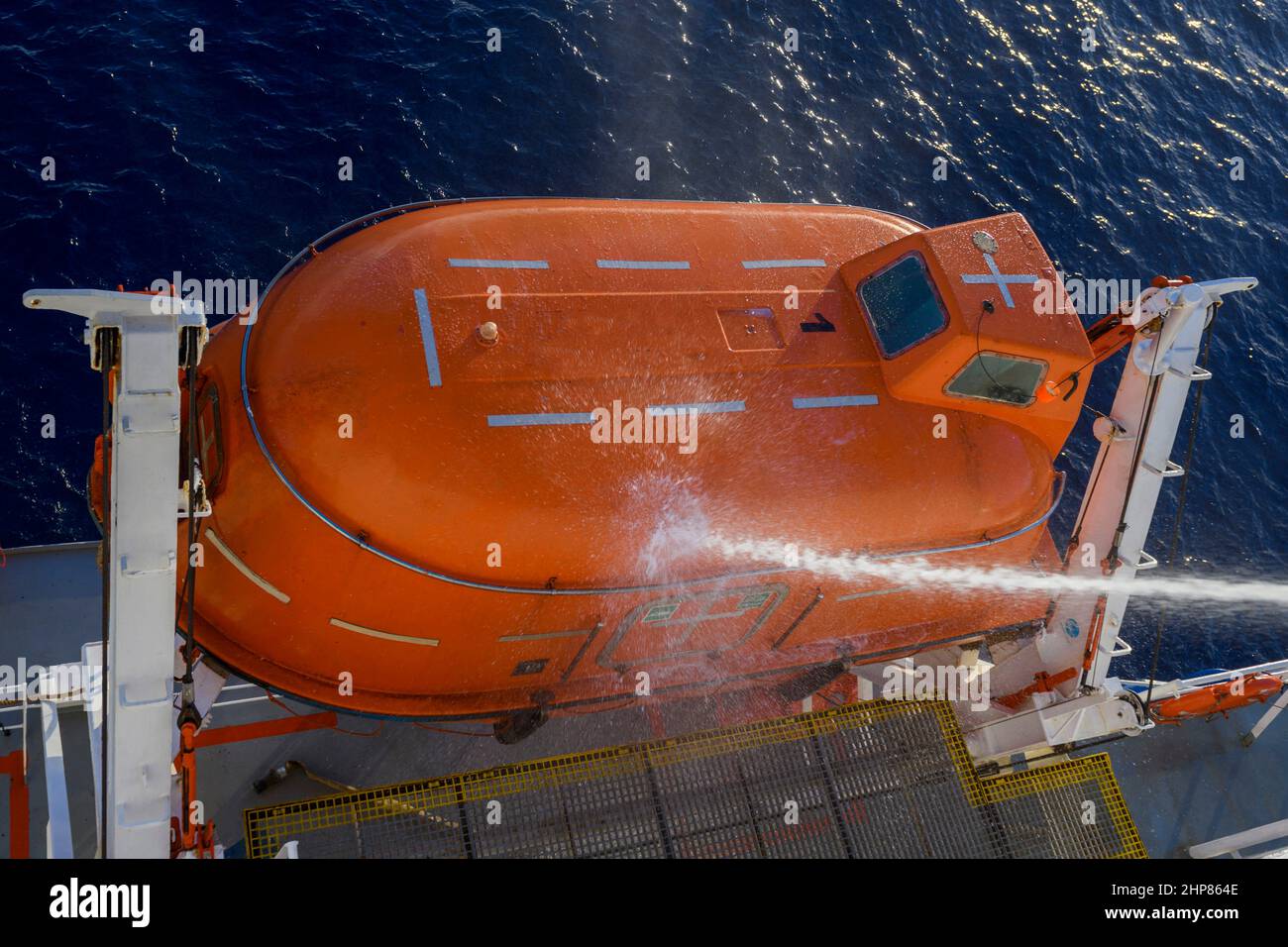 Hose pressure water test of totally enclosed lifeboat. Watertight test ...
