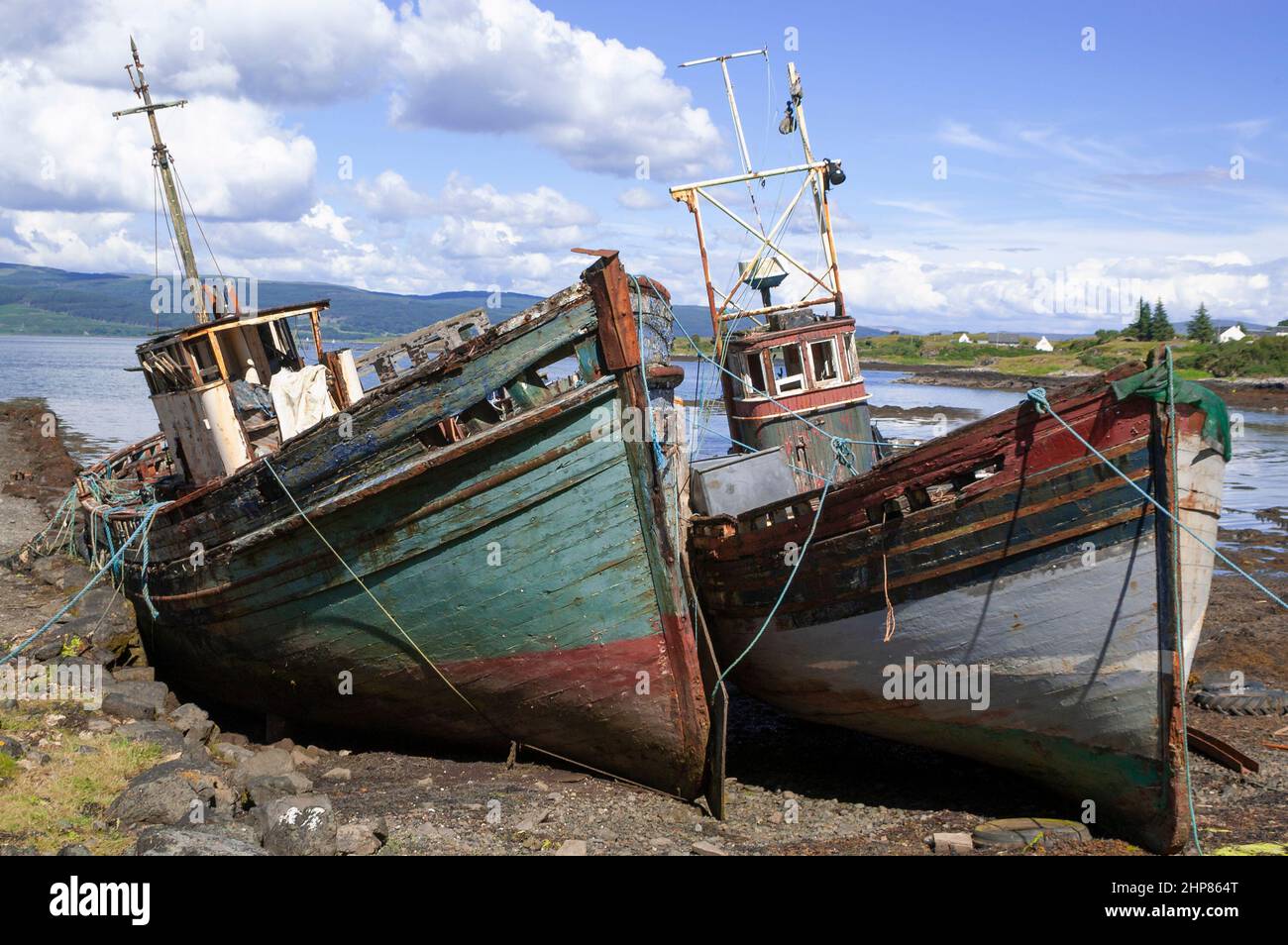 Two old wooden herring fishing boats beached on the shore at Salen ...