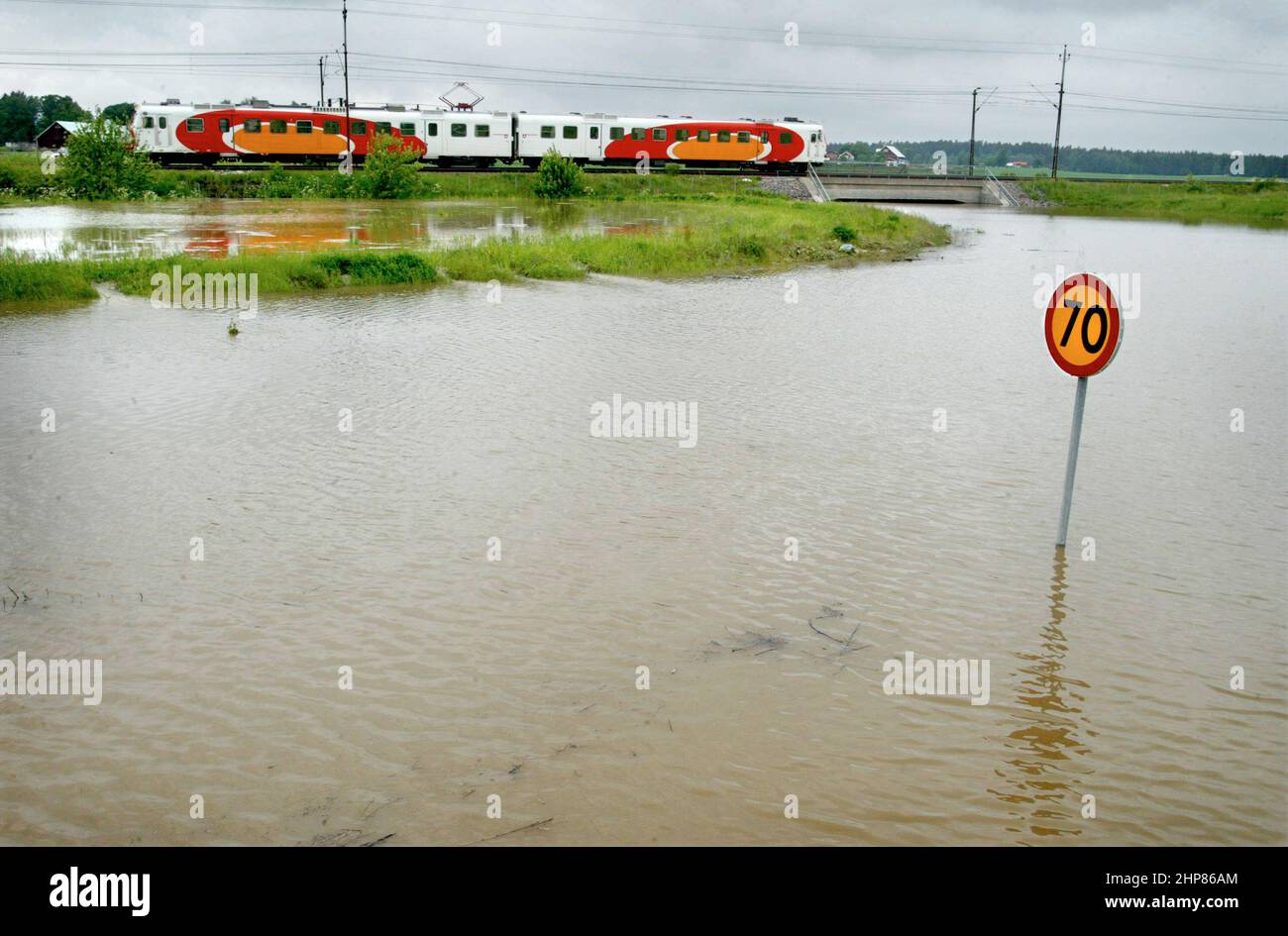 Flood of a country road in the countryside Stock Photo - Alamy