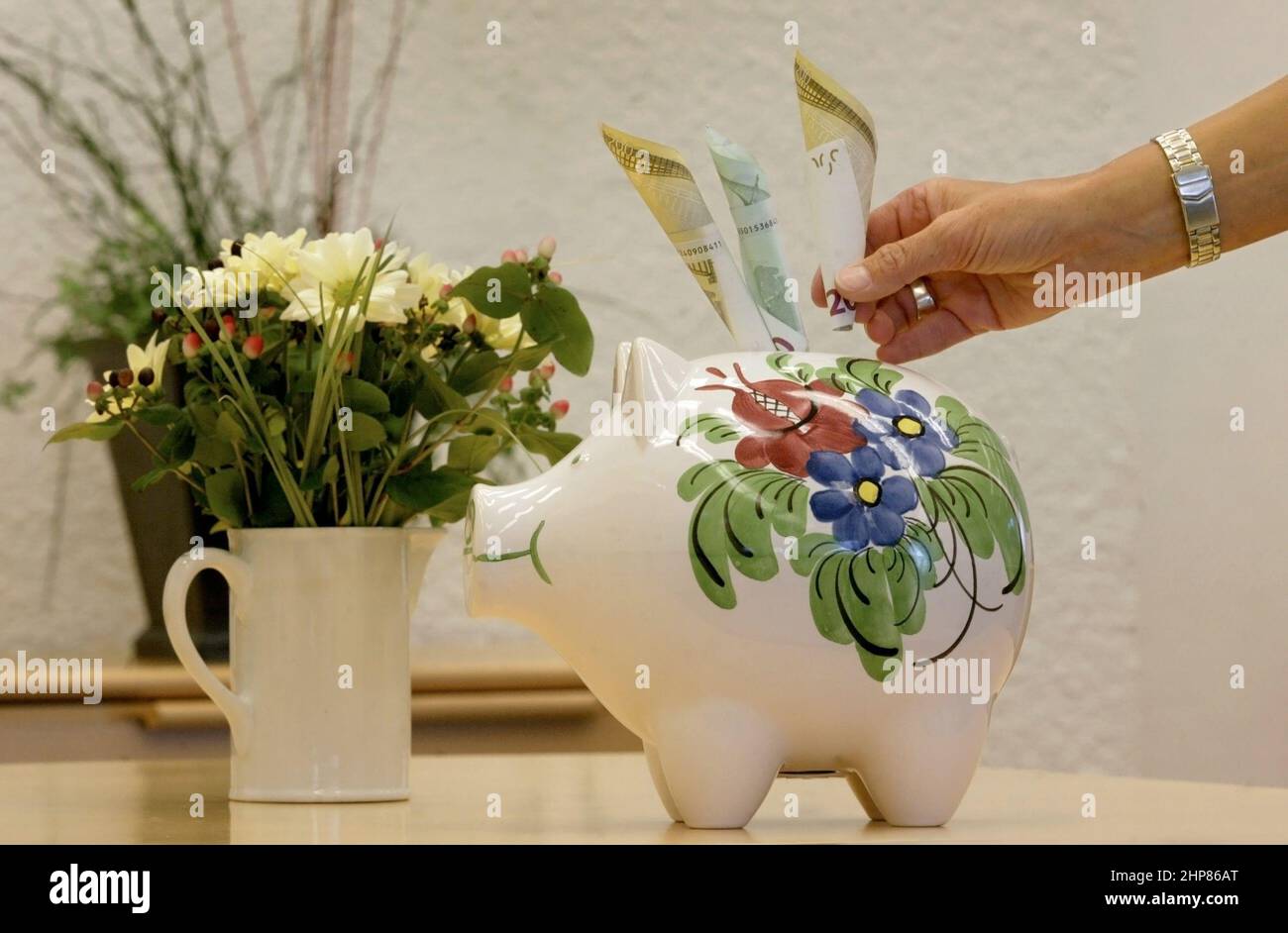 Different euro banknotes in a bank. The euro (symbol: €; code: EUR) is ...