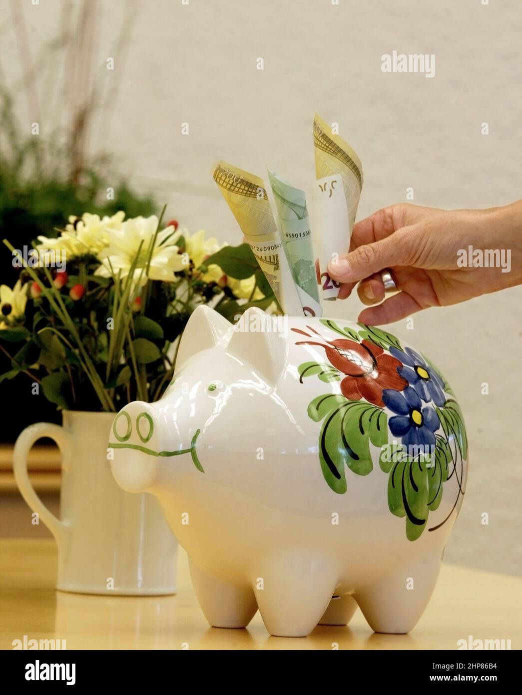 Different euro banknotes in a bank. The euro (symbol: €; code: EUR) is ...