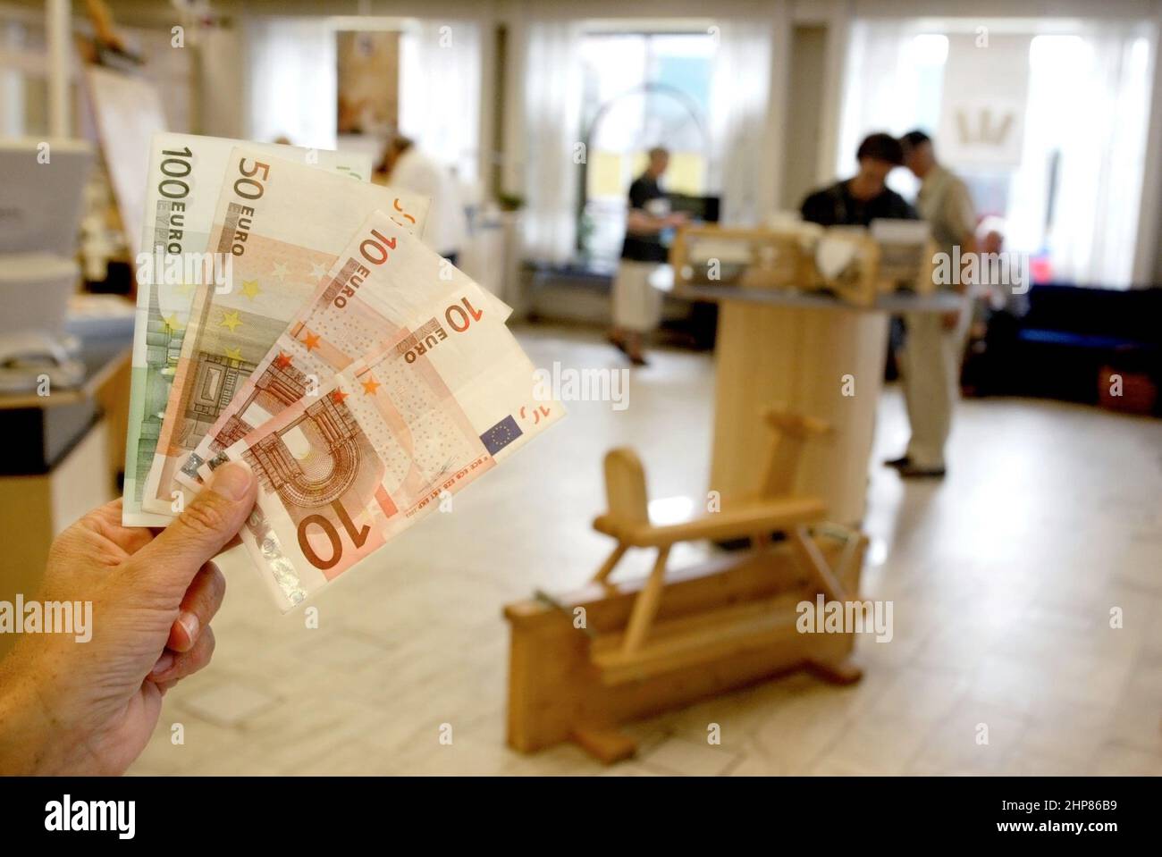 Different euro banknotes in a bank. The euro (symbol: €; code: EUR) is ...