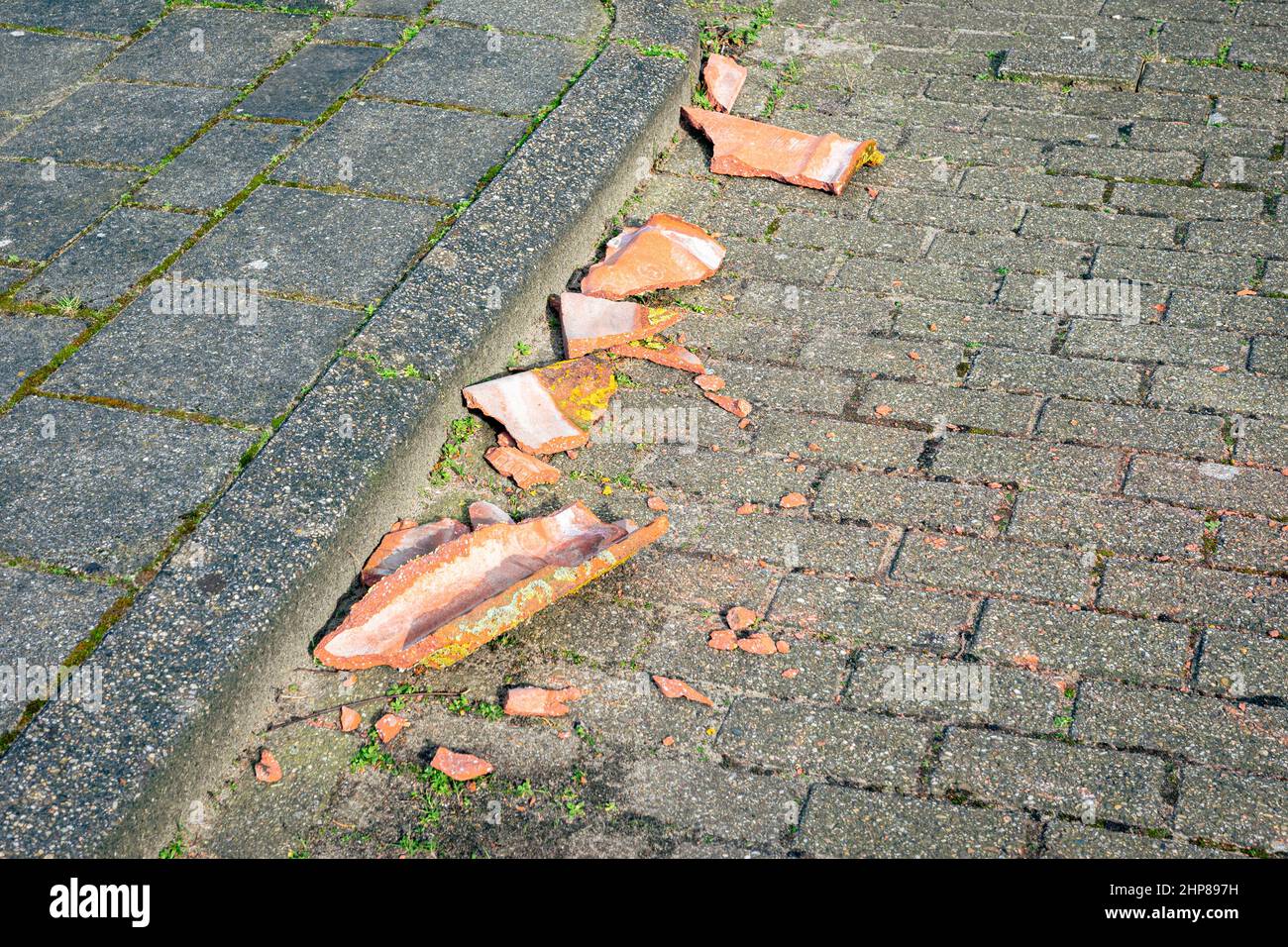 Broken roof tiles have been blown off a roof during a severe winter ...