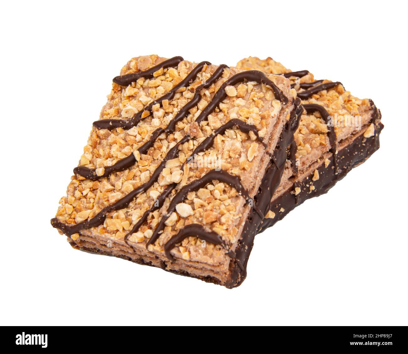 Tasty wafer snack with dropped nuts and chocolate isolated on the white ...
