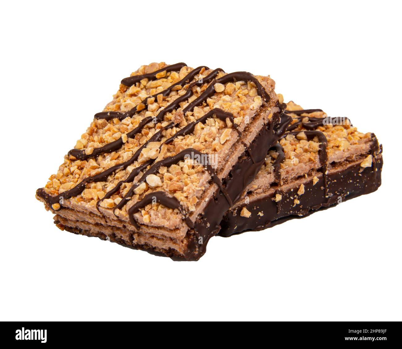 Tasty wafer snack with dropped nuts and chocolate isolated on the white ...