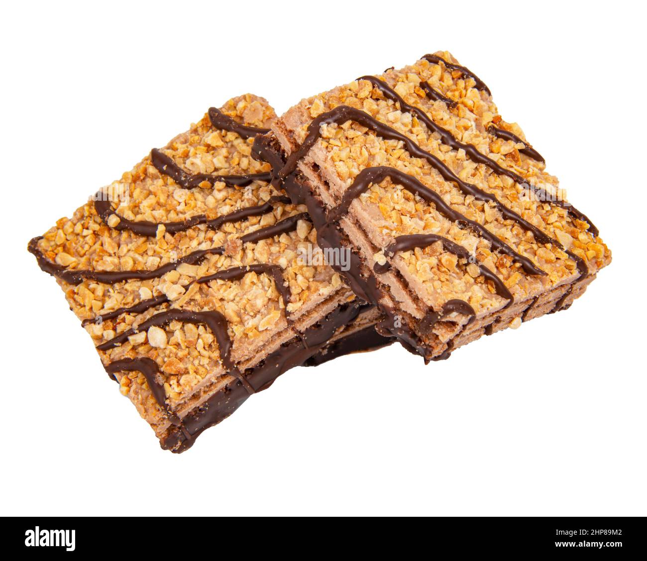 Tasty wafer snack with dropped nuts and chocolate isolated on the white ...
