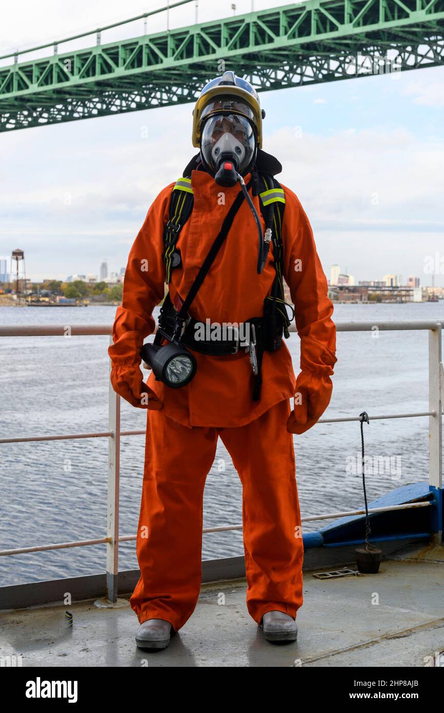 Fireman. Fire fighting equipment. Fire drill. Seaman with fire-fighter ...