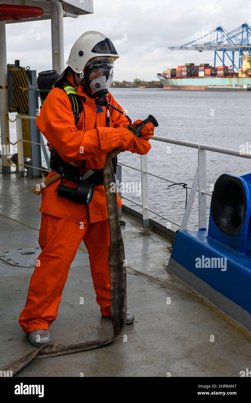 Fireman. Fire fighting equipment. Fire drill. Seaman with fire-fighter ...