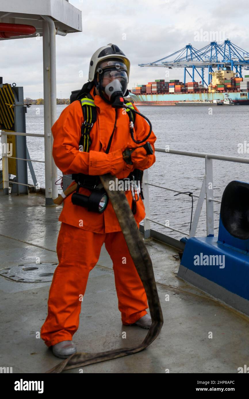 Fireman. Fire fighting equipment. Fire drill. Seaman with fire-fighter ...