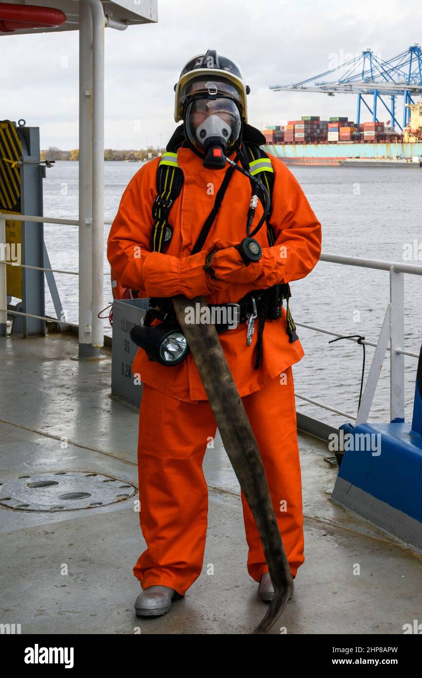 Fireman. Fire fighting equipment. Fire drill. Seaman with fire-fighter ...