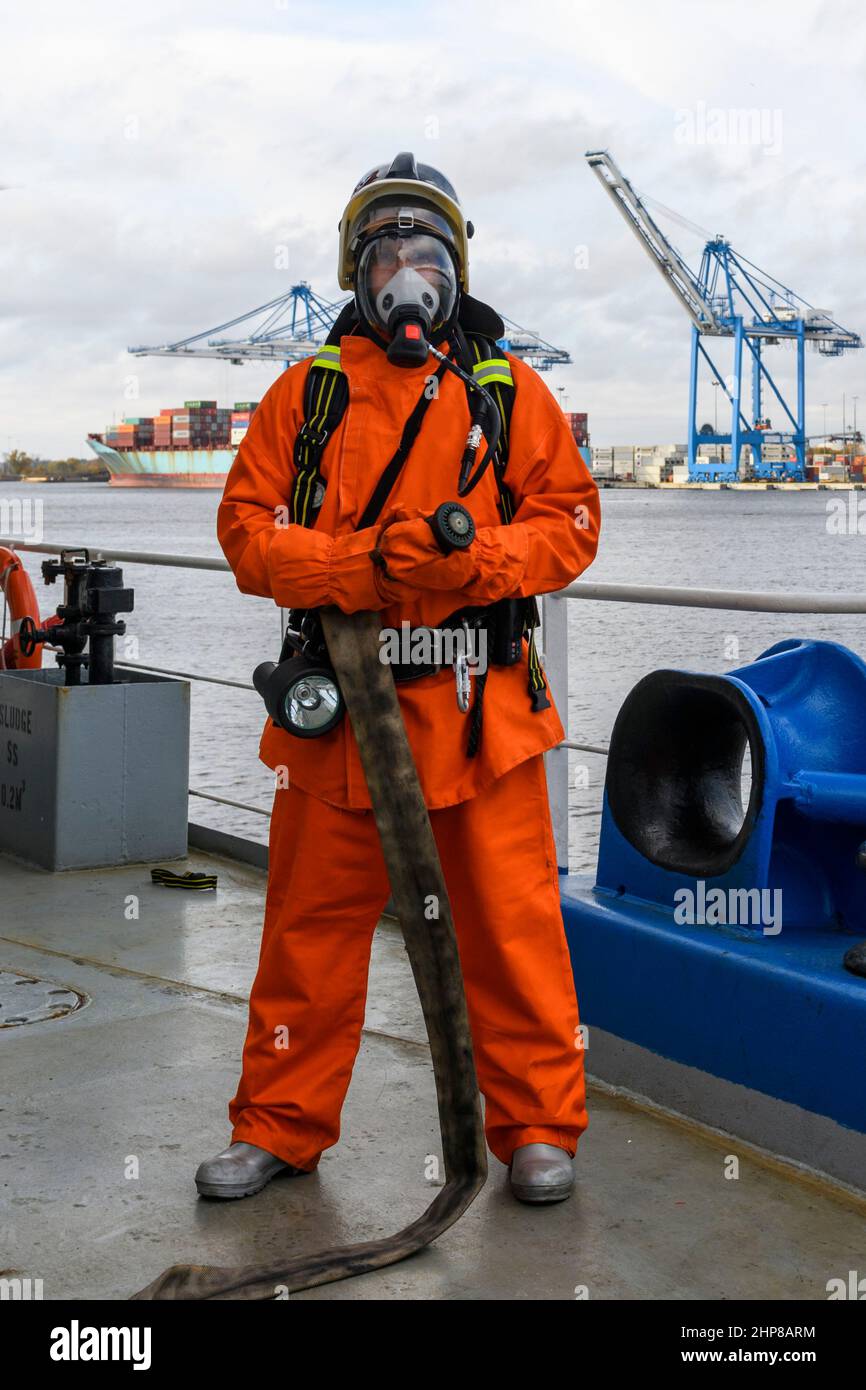 Fireman. Fire fighting equipment. Fire drill. Seaman with fire-fighter ...