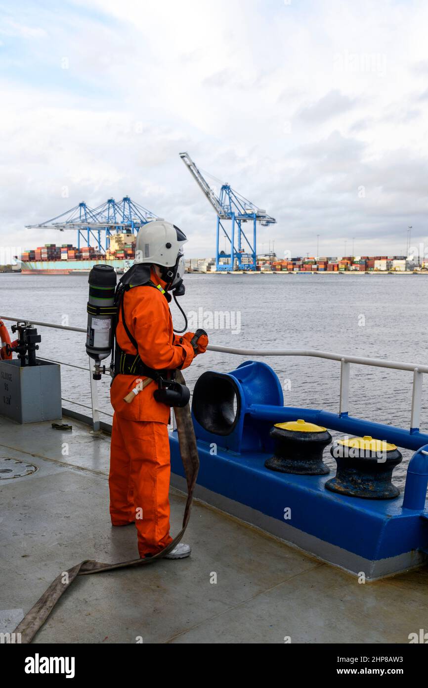 Fireman. Fire fighting equipment. Fire drill. Seaman with fire-fighter ...