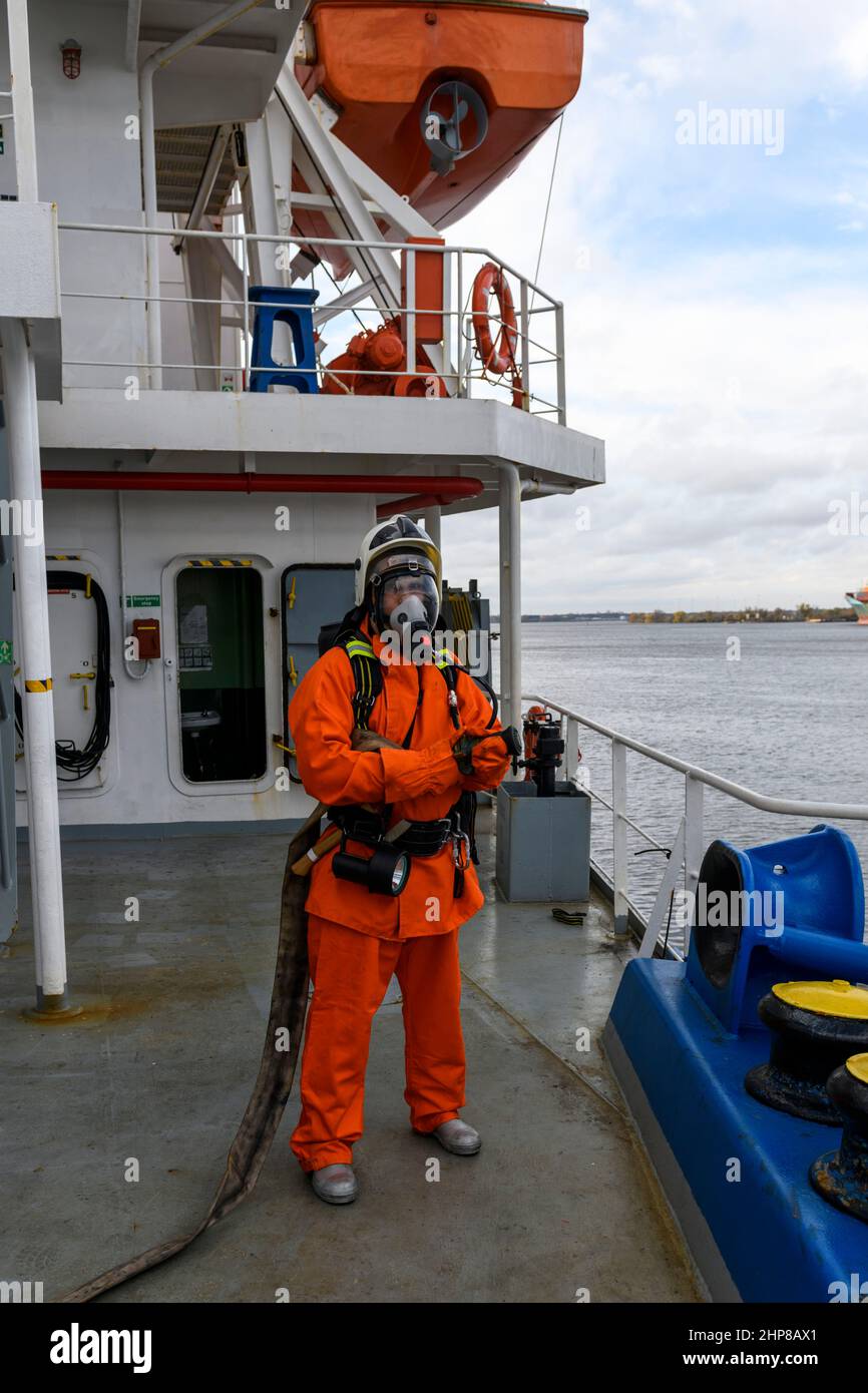Fireman. Fire fighting equipment. Fire drill. Seaman with fire-fighter ...