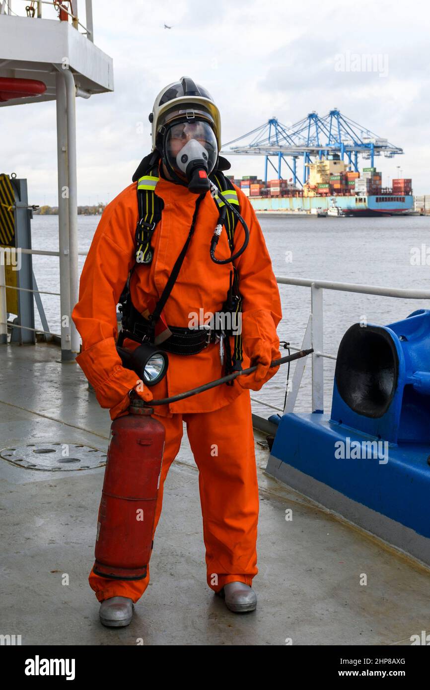 Fireman. Fire fighting equipment. Fire drill. Seaman with fire-fighter ...