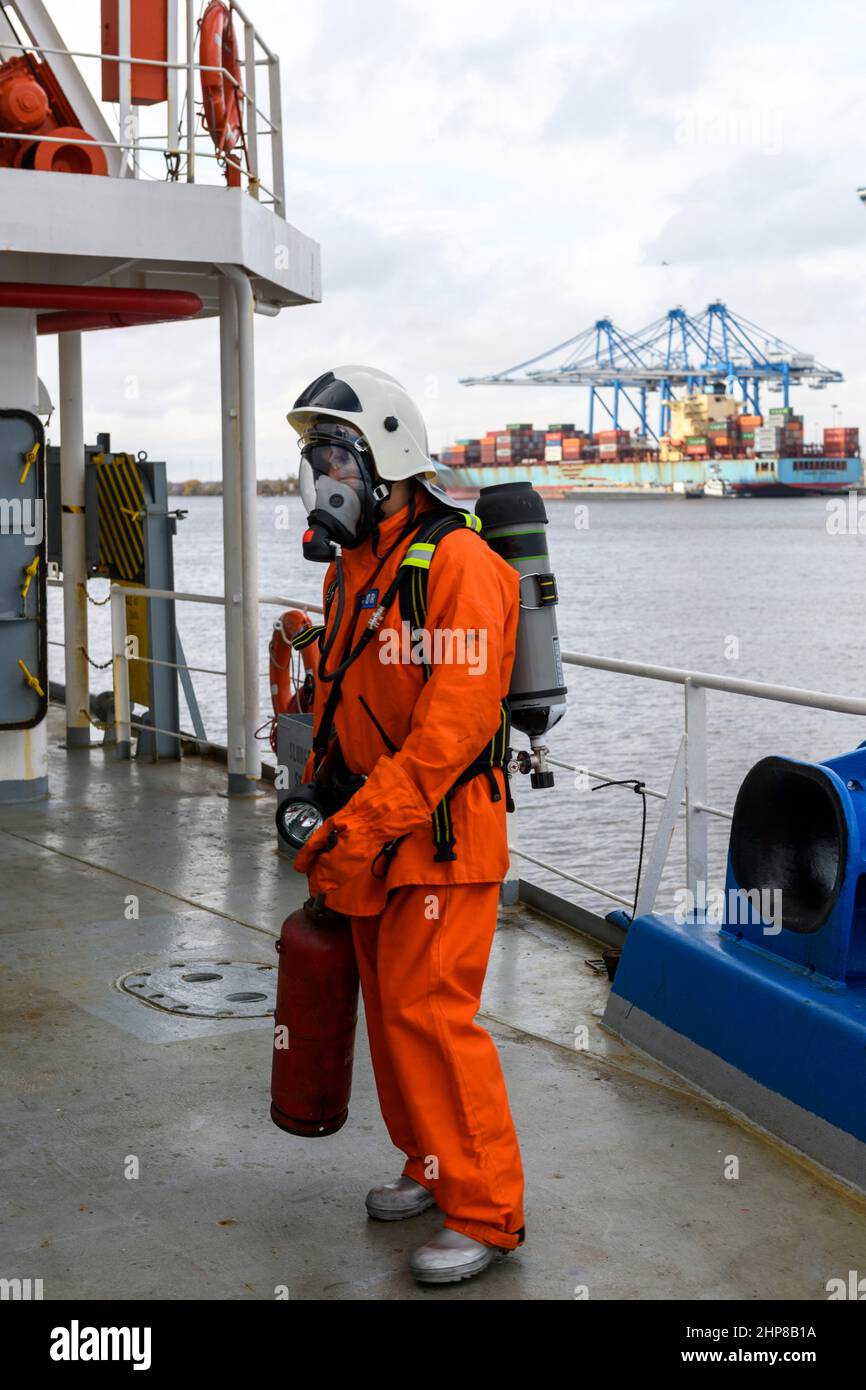 Fireman. Fire fighting equipment. Fire drill. Seaman with fire-fighter ...