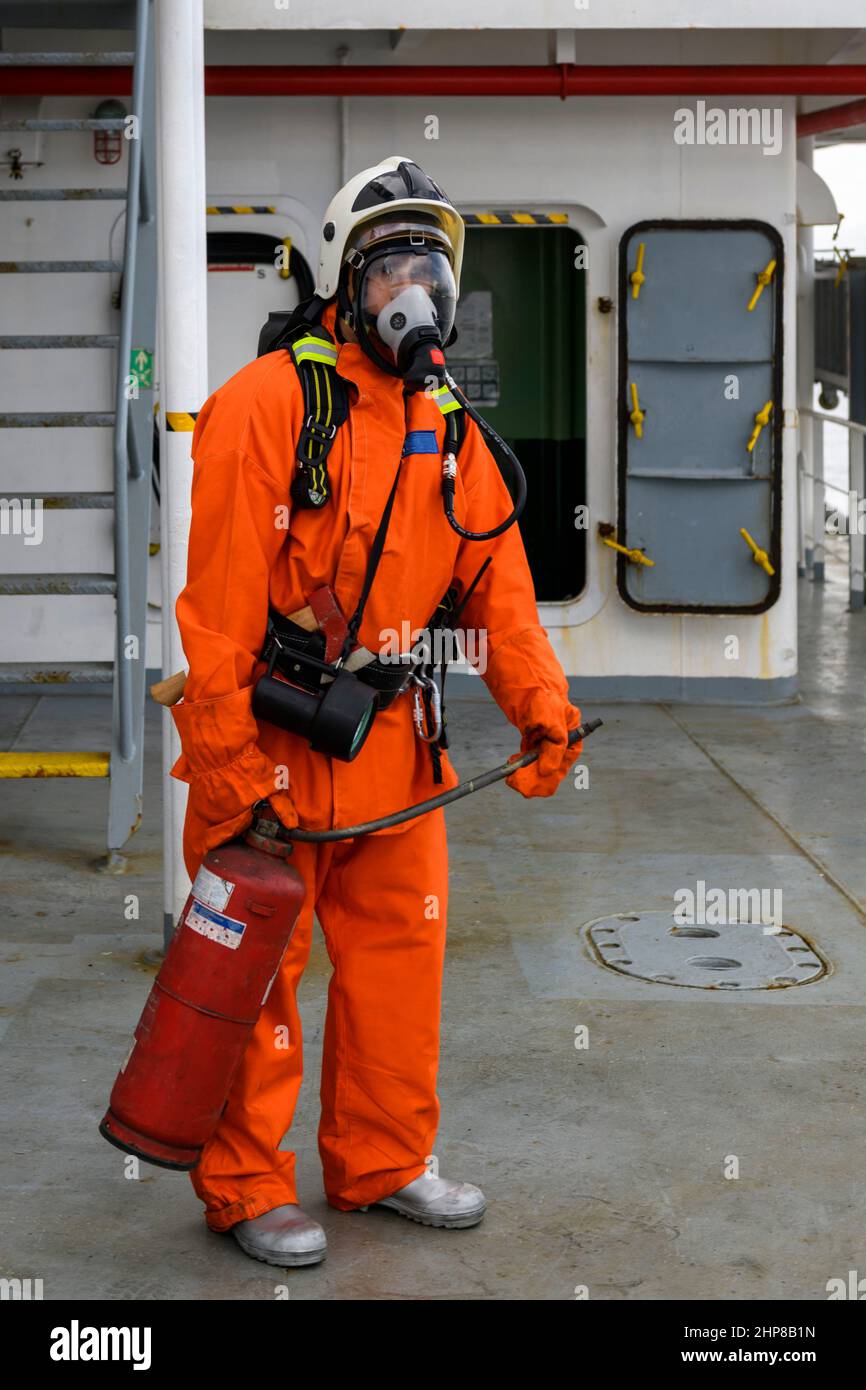Fireman. Fire fighting equipment. Fire drill. Seaman with fire-fighter ...
