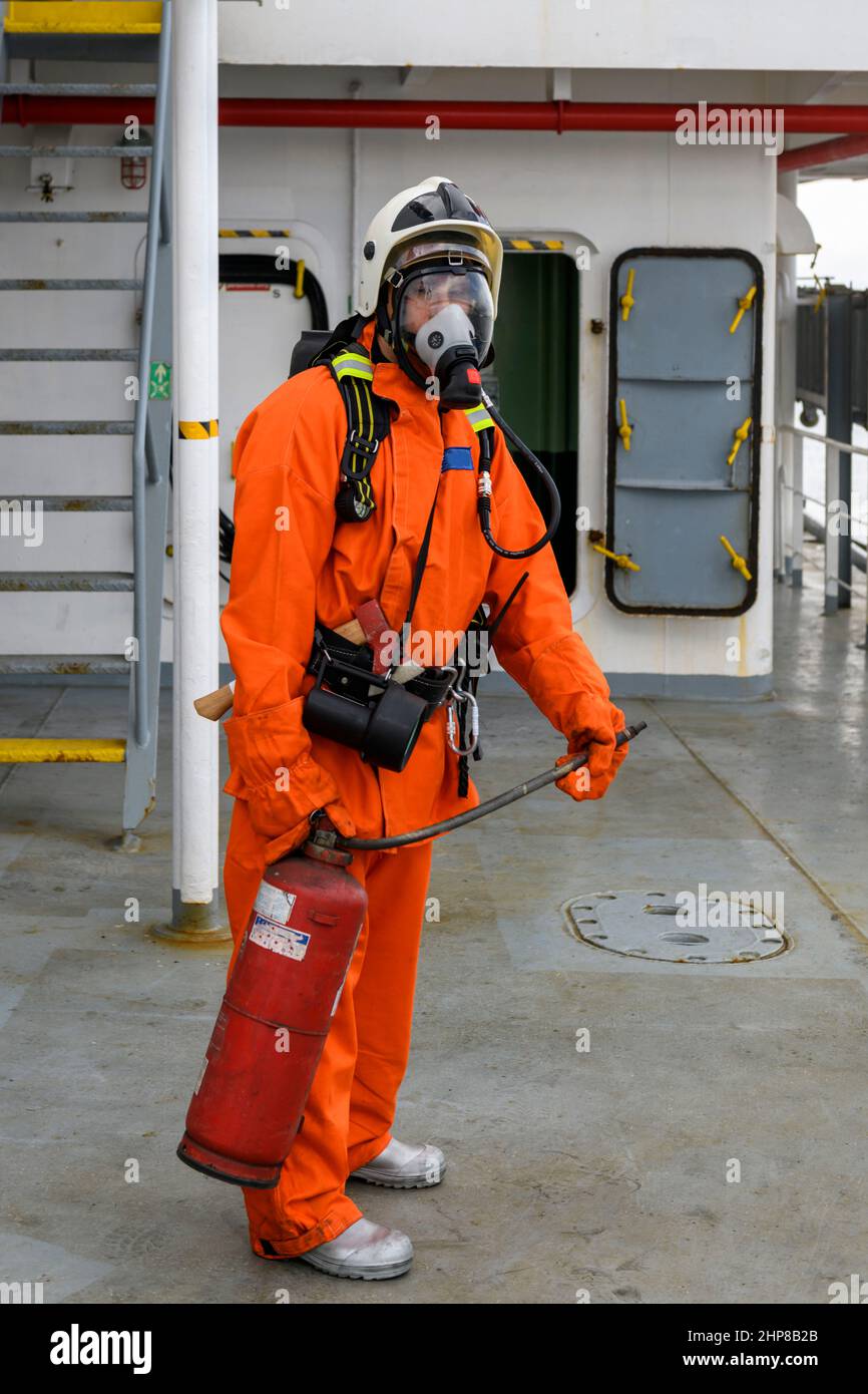 Fireman. Fire fighting equipment. Fire drill. Seaman with fire-fighter ...