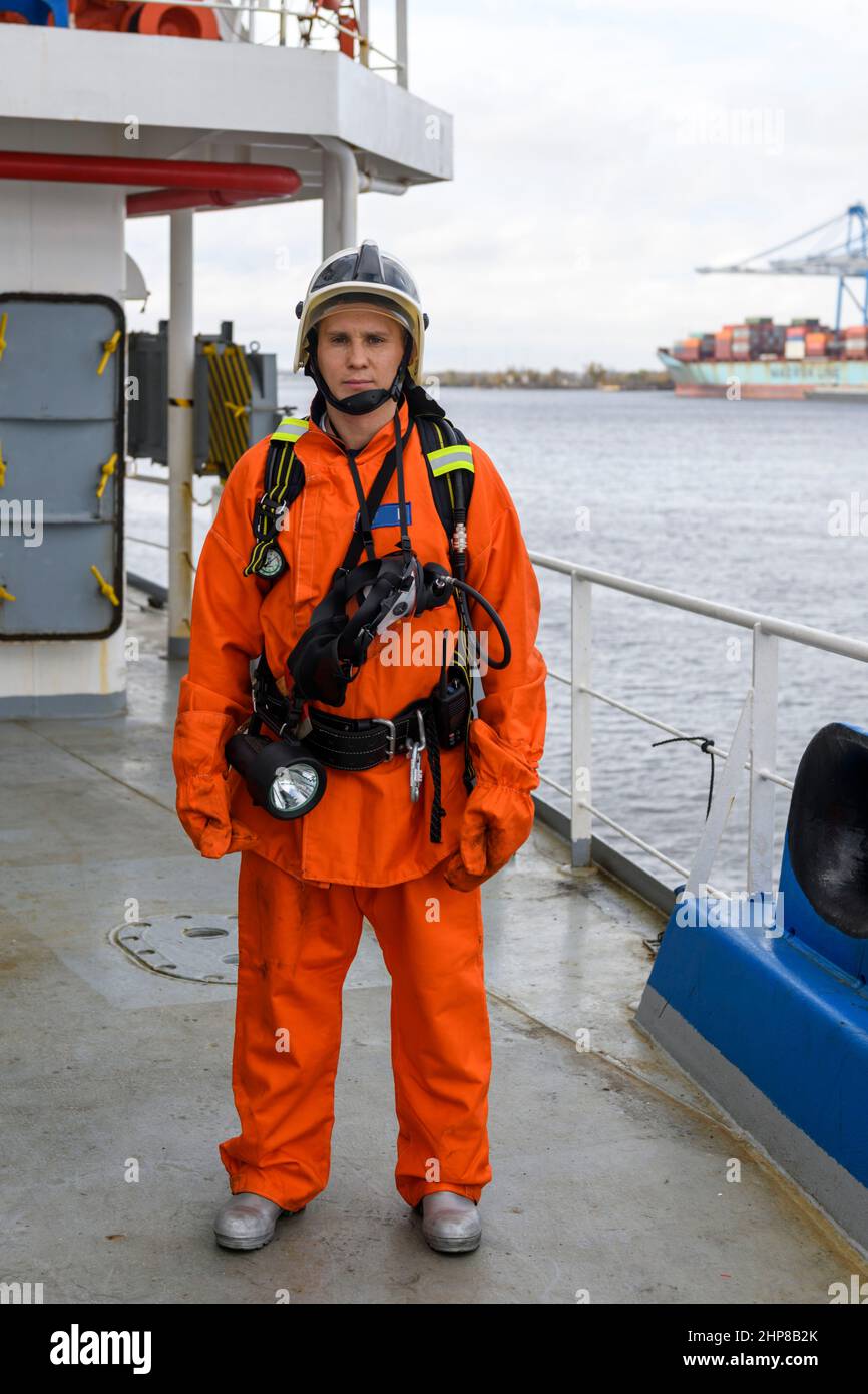 Fireman. Fire fighting equipment. Fire drill. Seaman with fire-fighter ...