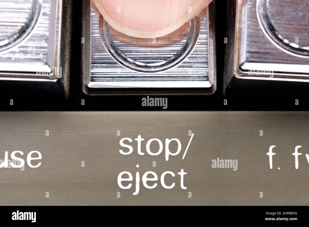 Finger pressed a stop button of a vintage tape recorder macro Stock ...