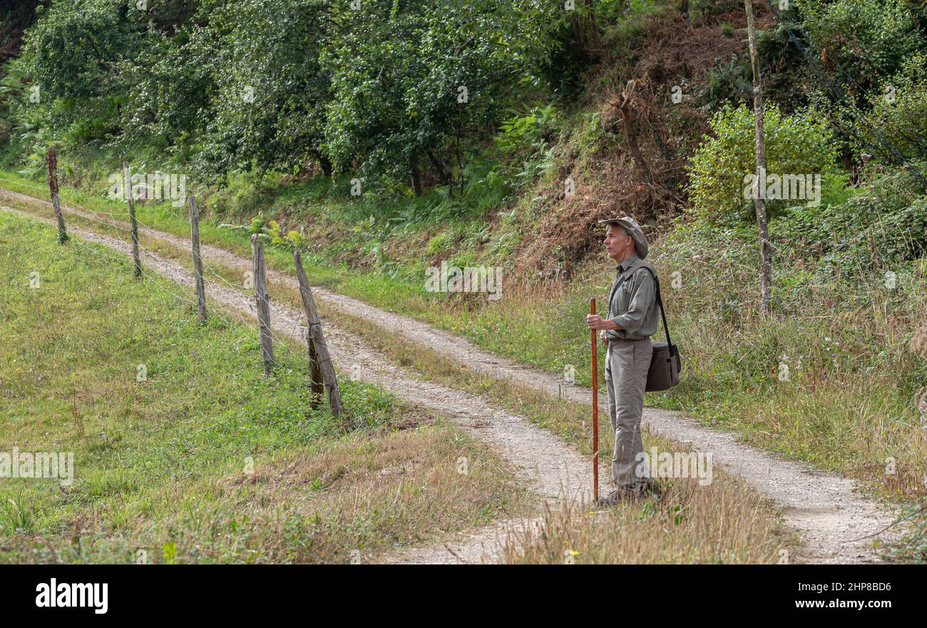 Backpacker pilgrim traveling the Camino de Santiago. Way of St James ...