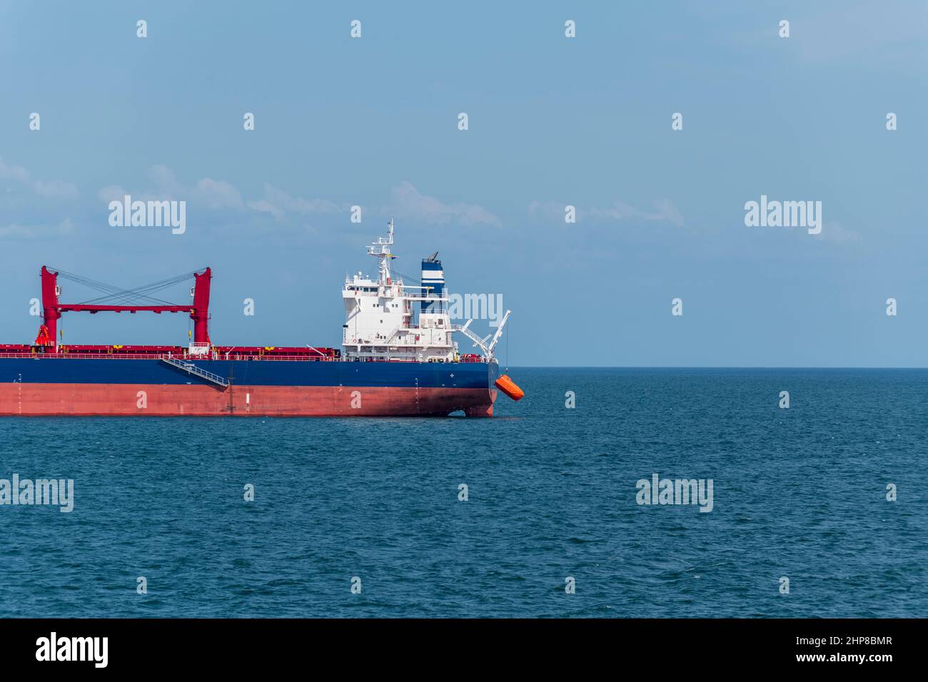 Lowering and Maneuvering orange free fall lifeboat in water. Abandon ...