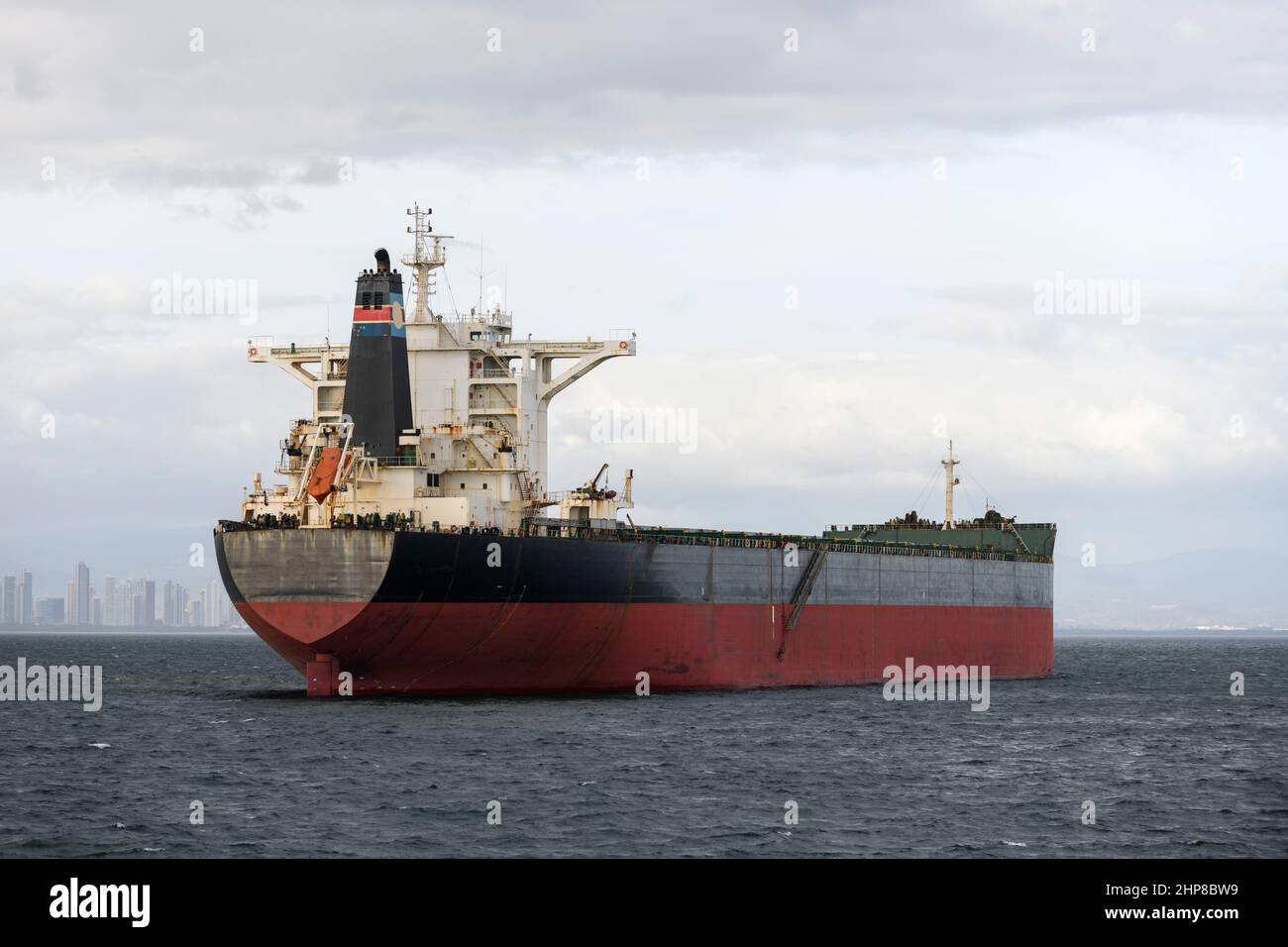 Cargo ship on the road. Bulk cargo vessel at sea. Logistics import and ...