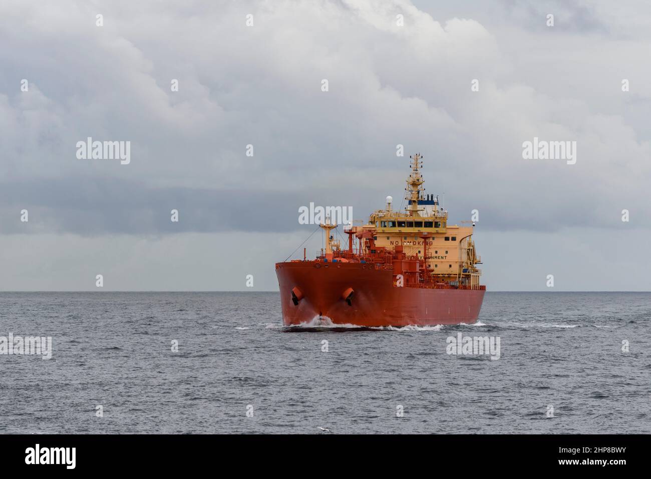 Tanker at sea. Cargo vessel with red hull sailing Stock Photo - Alamy
