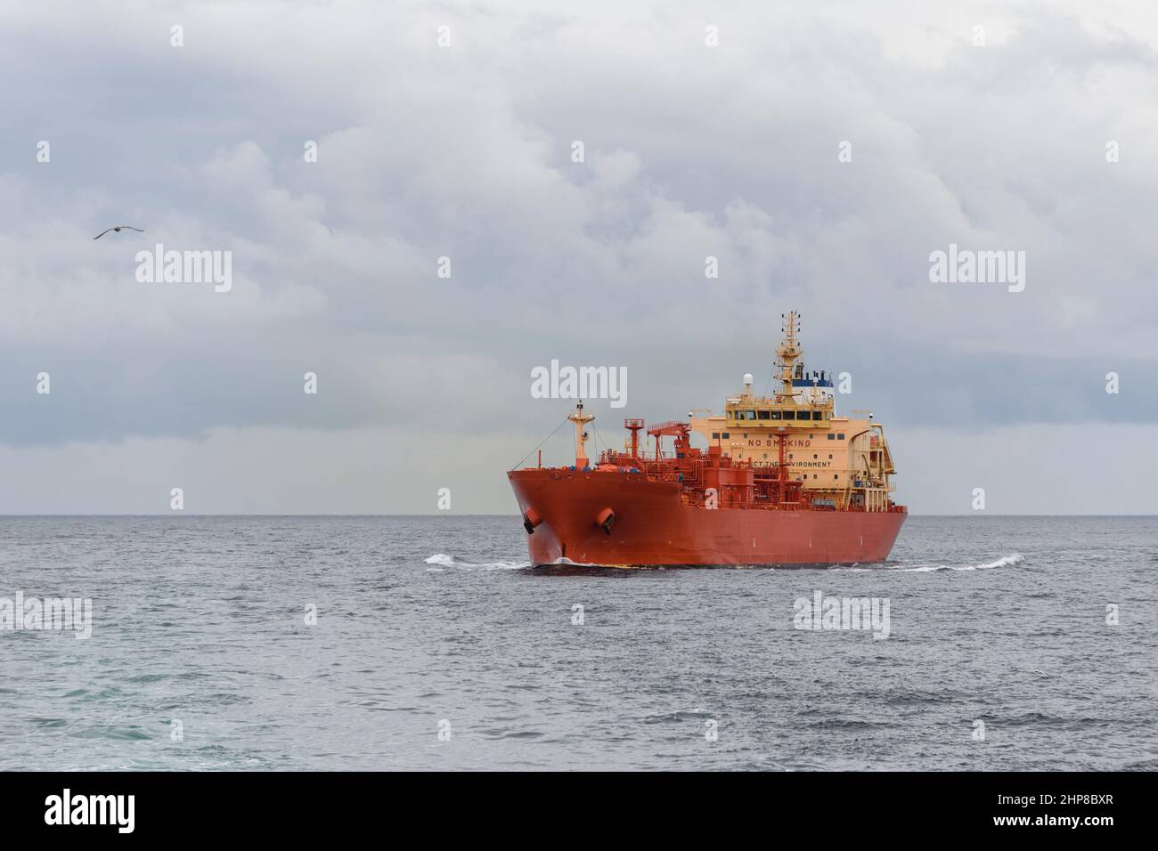 Tanker at sea. Cargo vessel with red hull sailing Stock Photo - Alamy