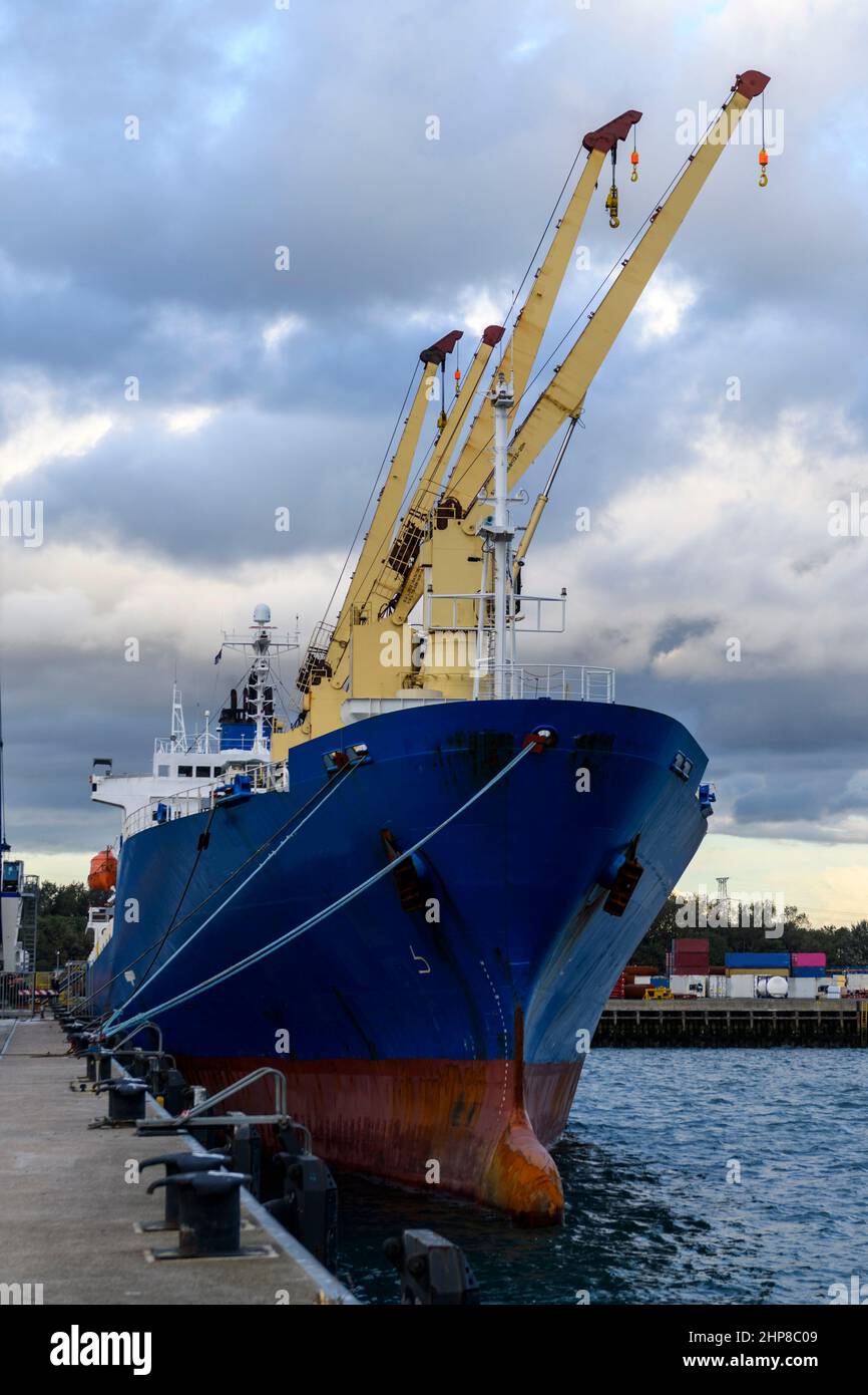 Blue refrigerated cargo vessel moored in port. Loading of cargo Stock ...
