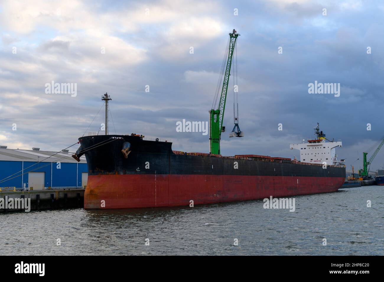 Bulk cargo vessel moored in port. Loading of cargo Stock Photo - Alamy