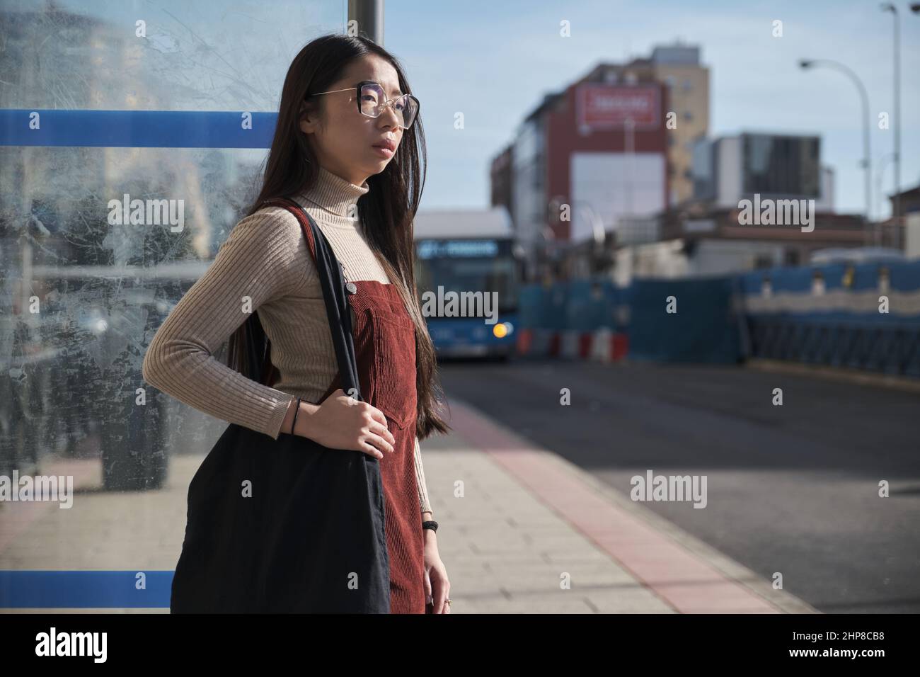 Girl alone at bus stop hi-res stock photography and images - Alamy