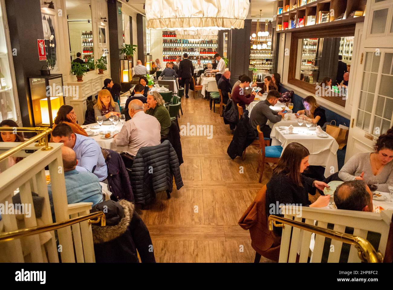 Madrid, Spain, Large Crowd of People Sharing Meals inside Contemporary ...